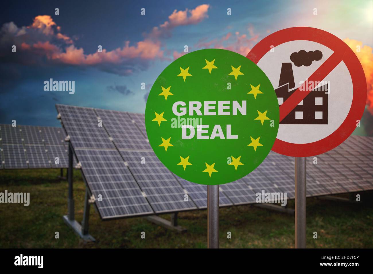 Green deal sign in front of photovoltaic panels. Renewable and ...