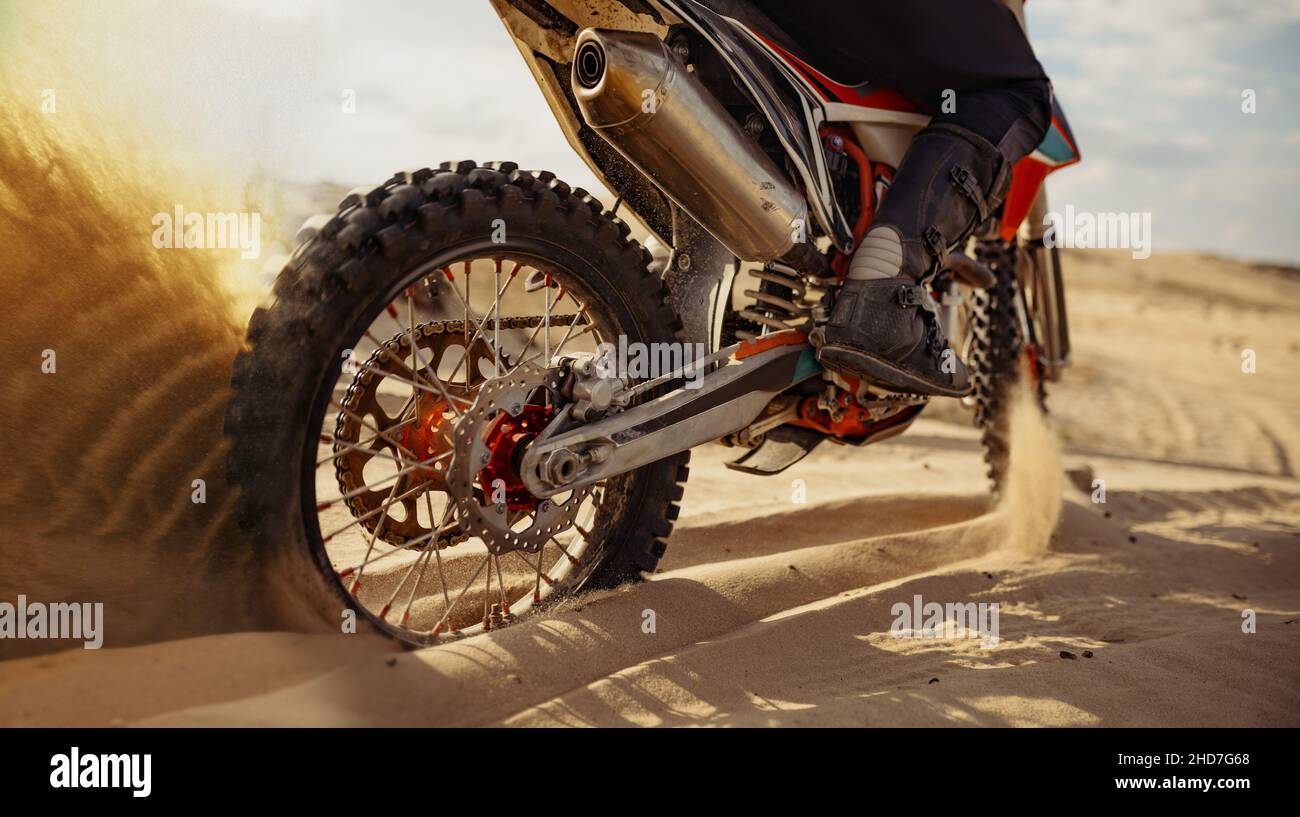 Rider driving in motocross race skid wheel Stock Photo - Alamy