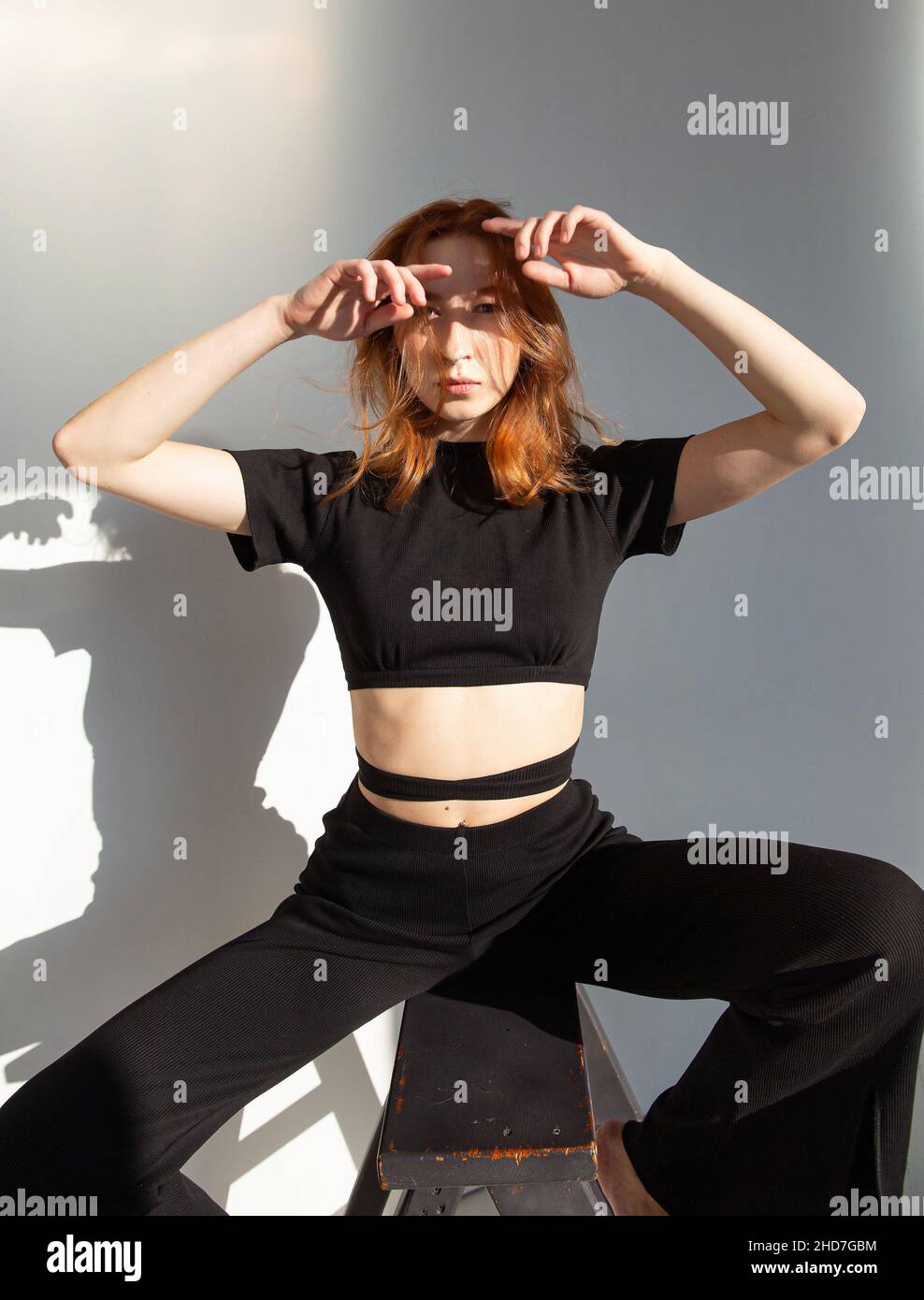 Young european woman with white skin dressed in black with white ...