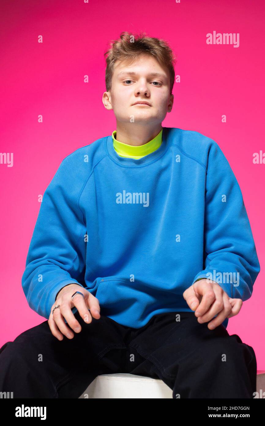 Young european boy with white skin isolated on pink in blue Stock Photo ...