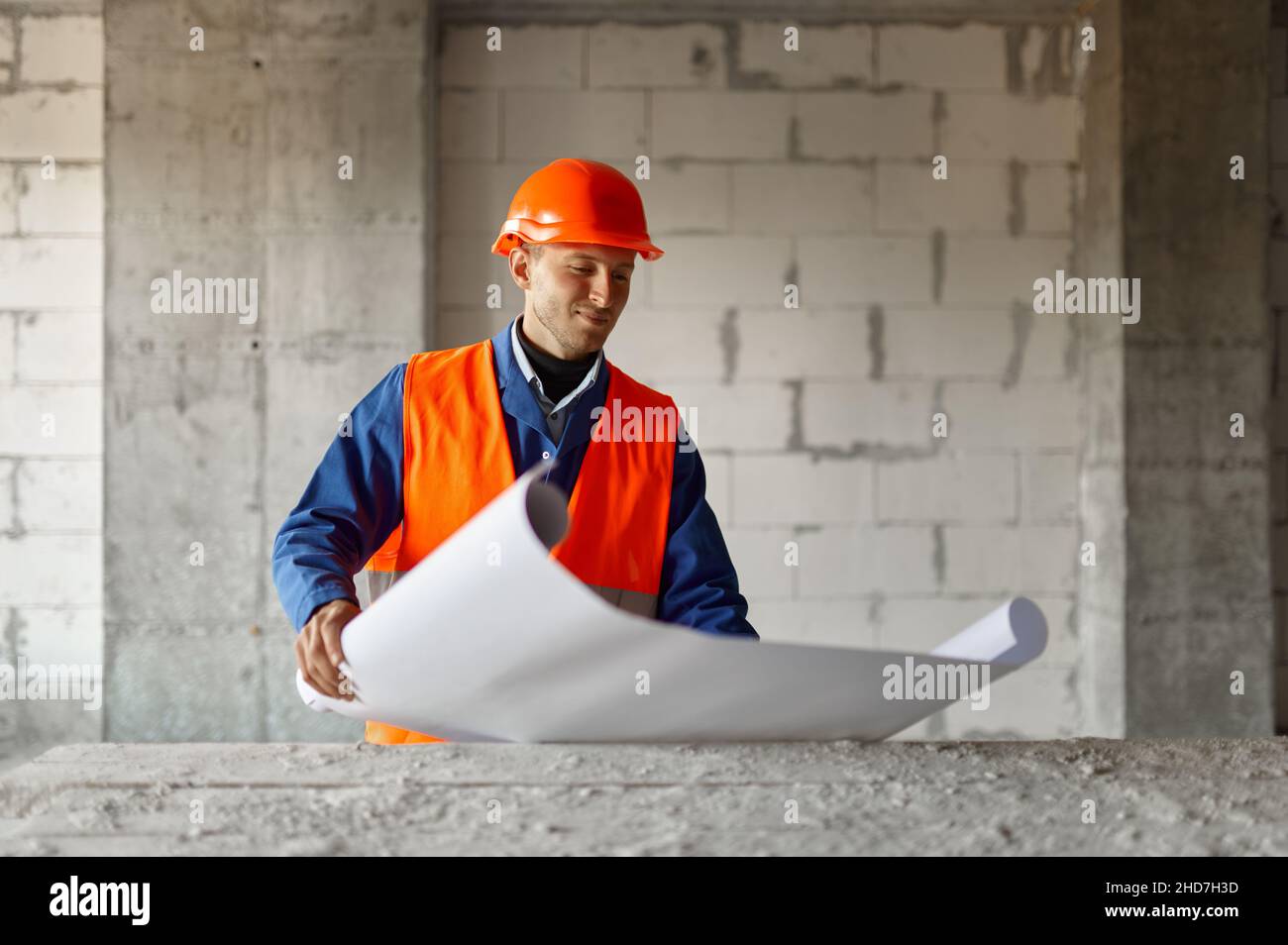 Male engineer builder with paper blueprint draft Stock Photo - Alamy
