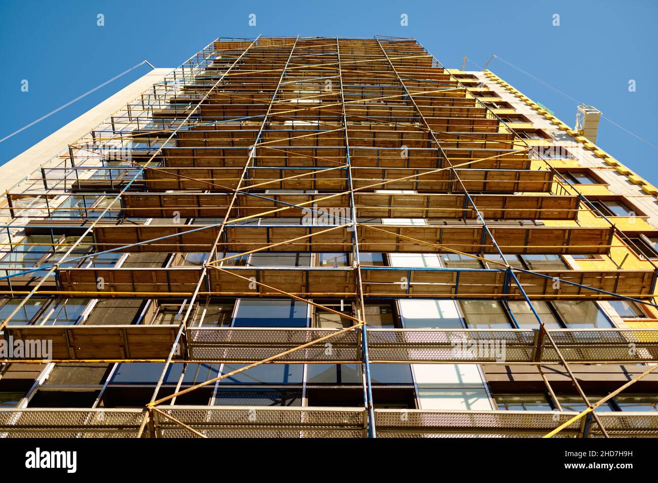High apartments building construction bottom up view Stock Photo - Alamy