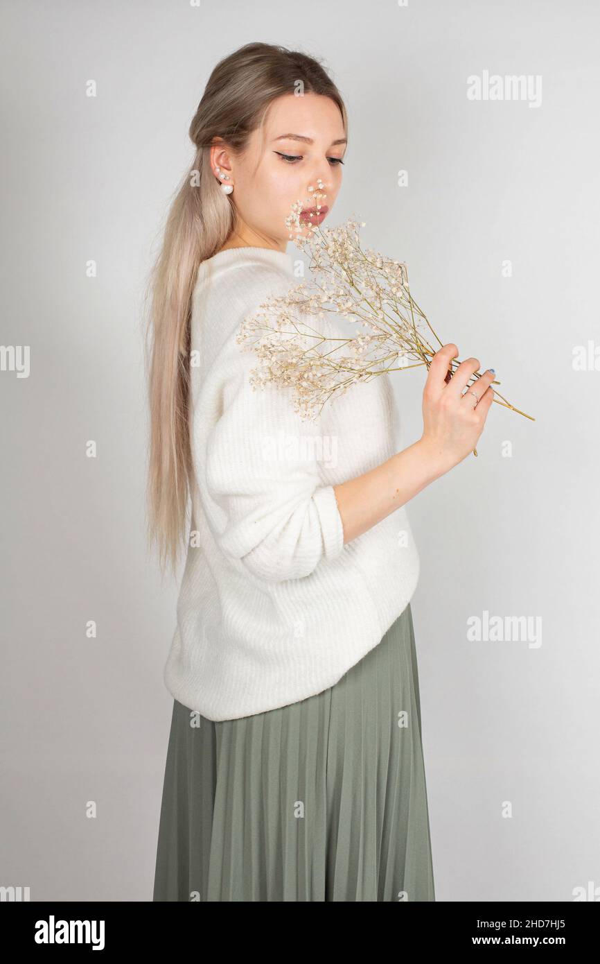Tender woman with long hair and white skin isolated on grey in white ...