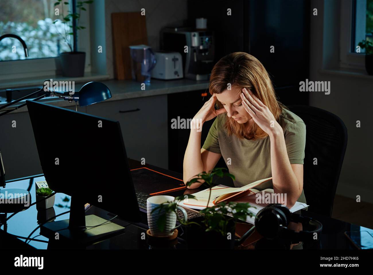 Woman works late at home workplace, remote work concept. Burnout and ...