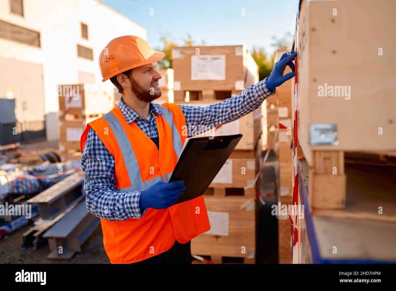 Contractor check delivered parcel at construction site Stock Photo - Alamy