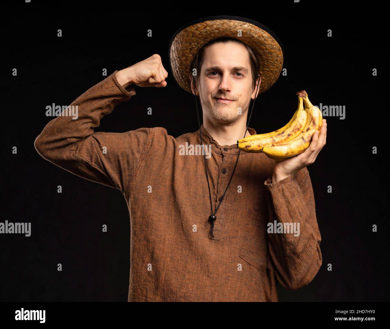 Young handsome tall slim white man with brown hair flexing his muscles ...