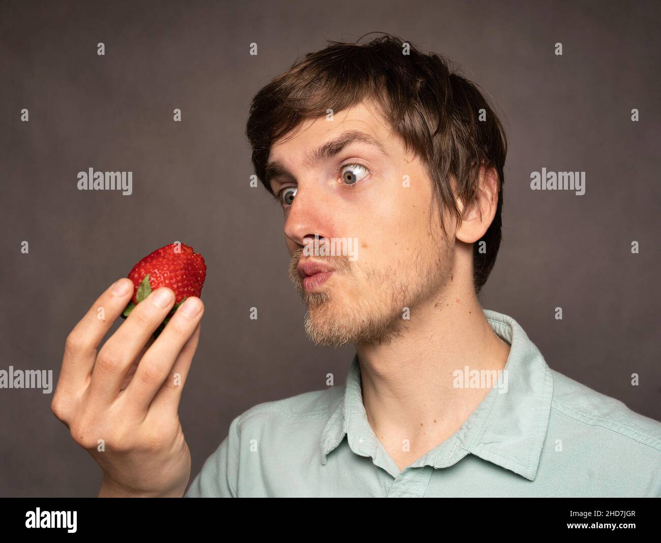 Young handsome tall slim white man with brown hair hypnotizing ...