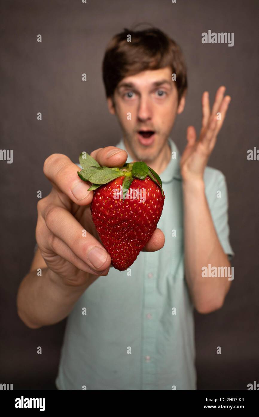 Young handsome tall slim white man with brown hair presenting one ...