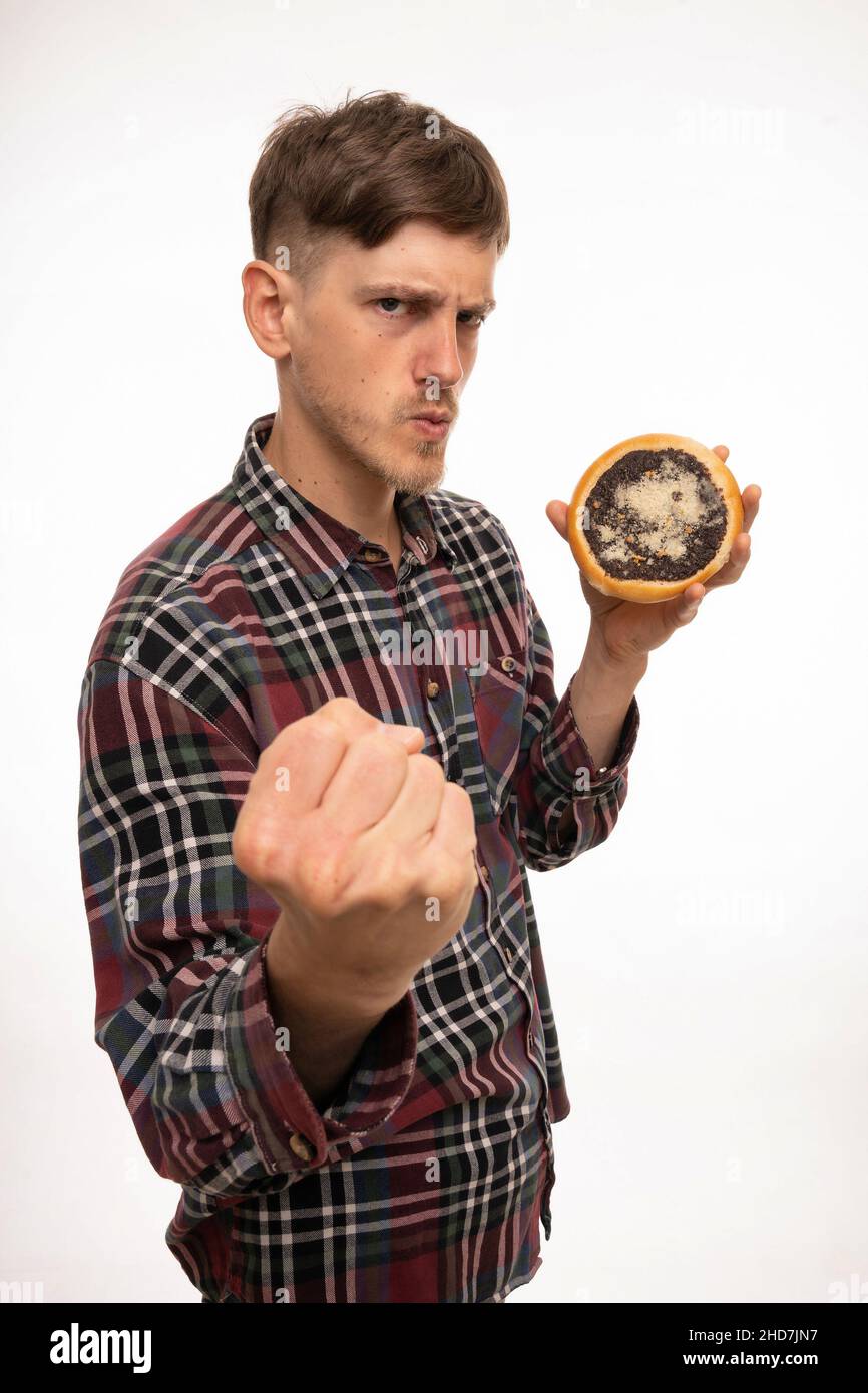 Young handsome tall slim white man with brown hair holding kolach ...