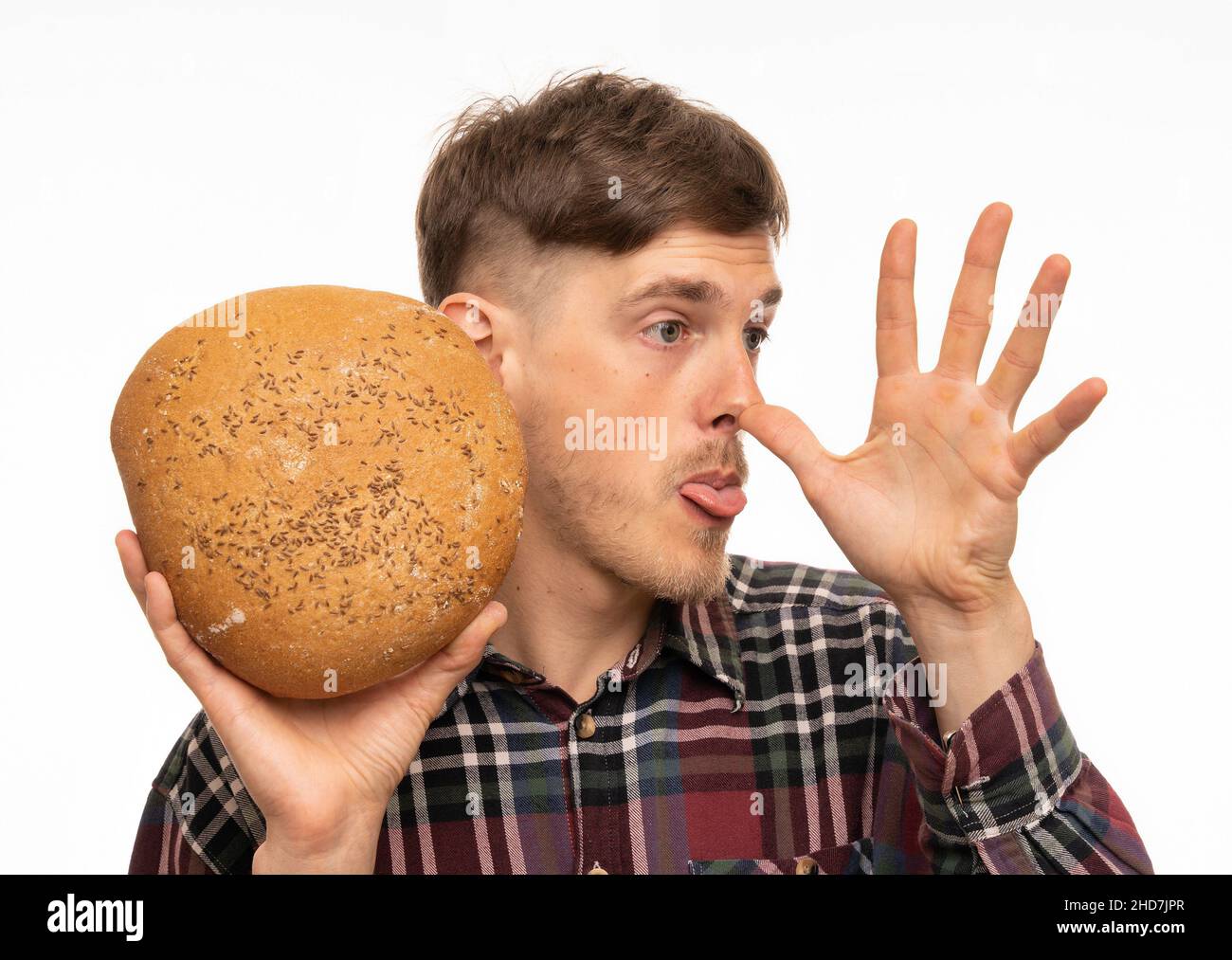 Young handsome tall slim white man with brown hair holding bread ...