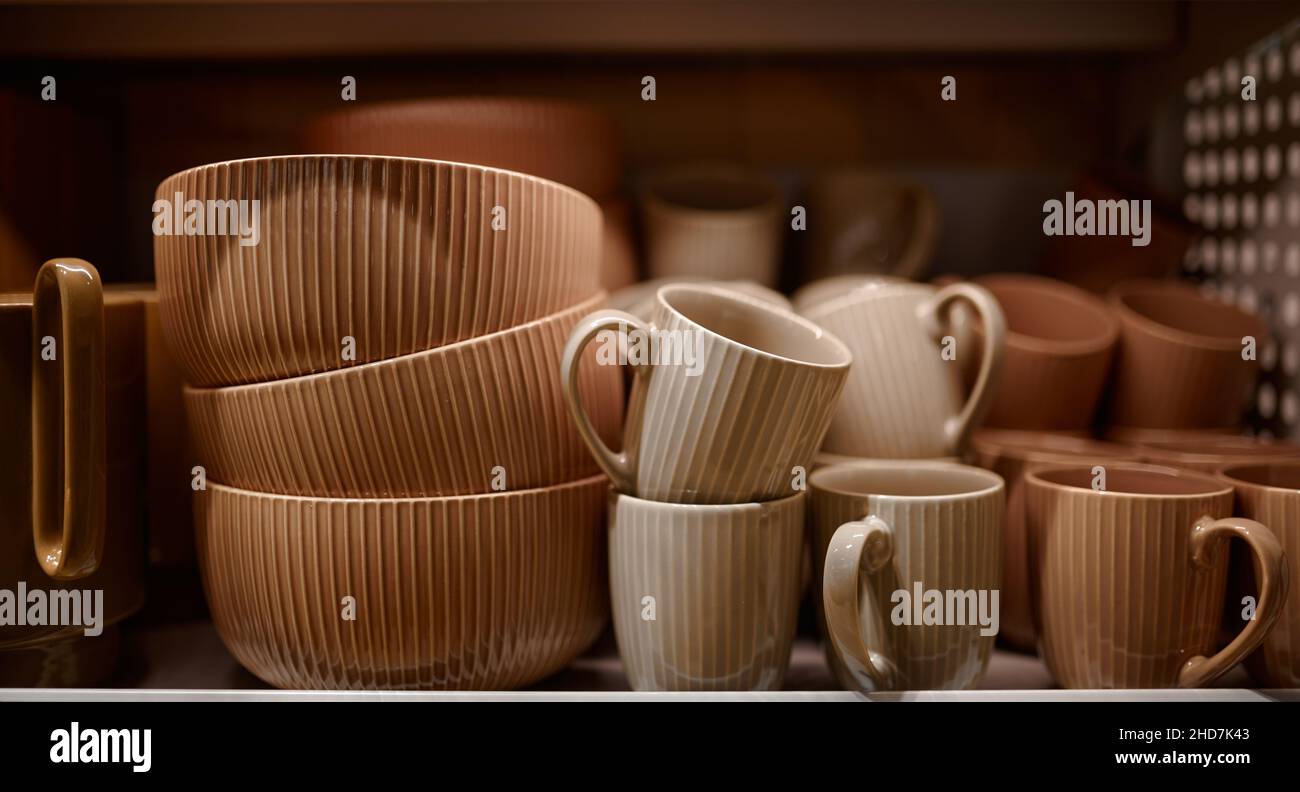 Ceramic kitchenware assortment on shop shelves rack Stock Photo - Alamy