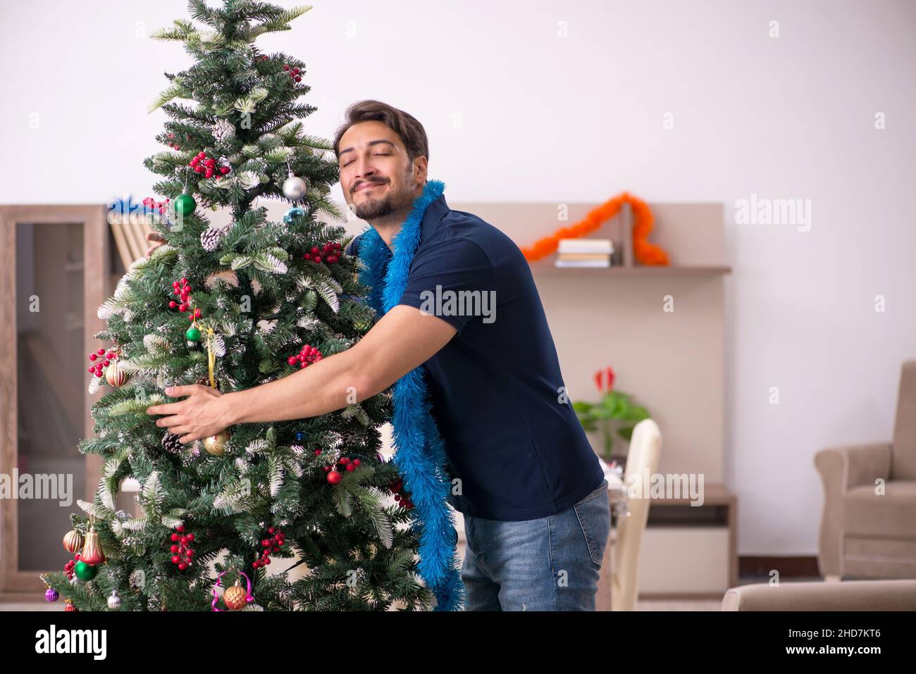Young man celebrating New year at home alone Stock Photo - Alamy