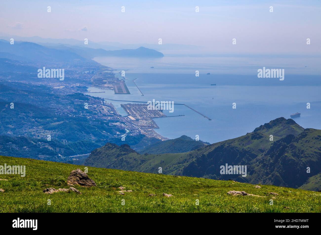 Aerial view of the Ligurian coast in Genoa, the airport and the port of ...