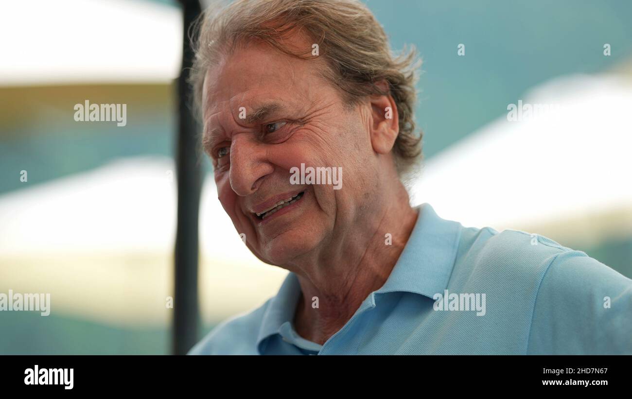 Candid older man portrait face smiling listening to conversation Stock ...