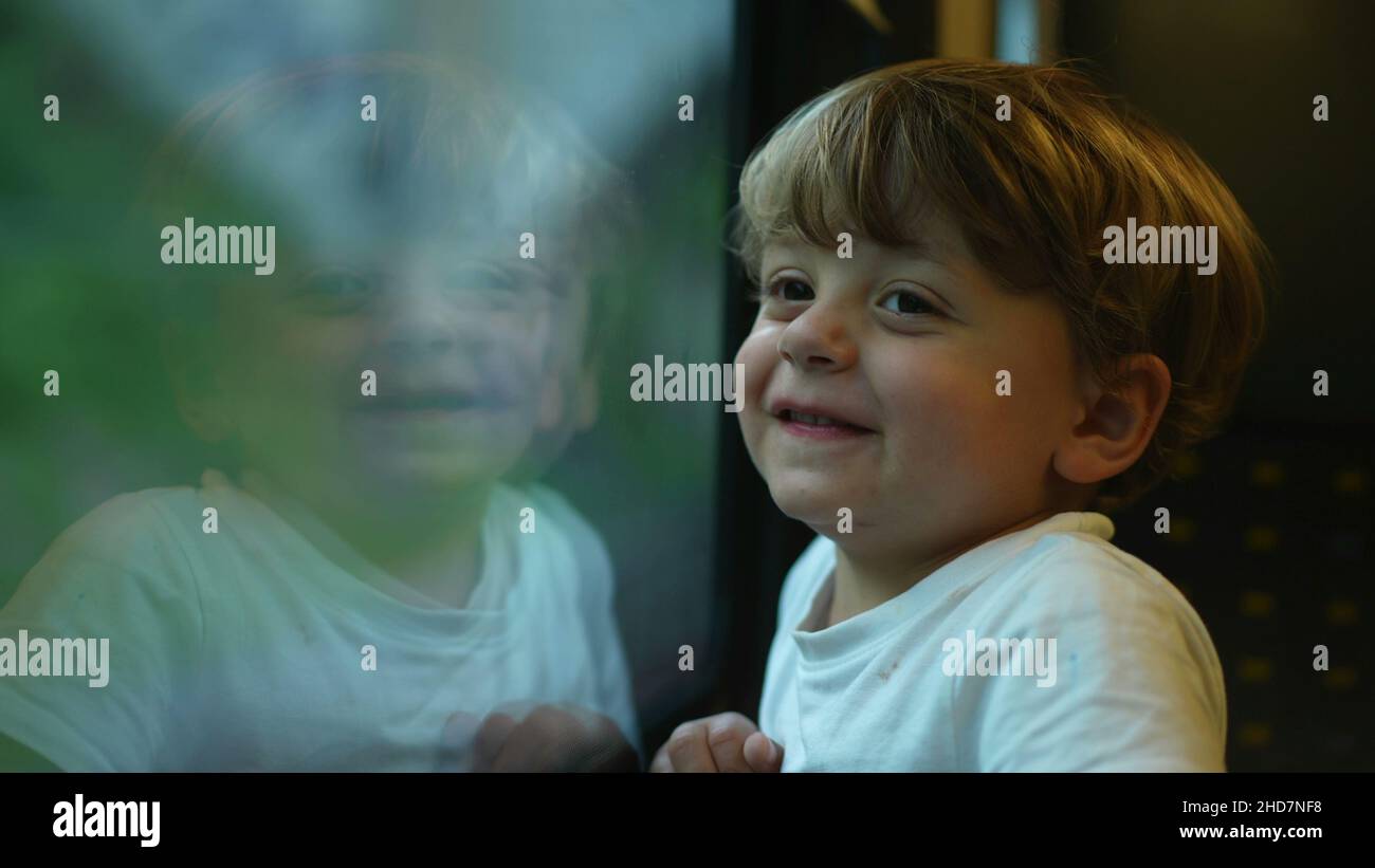 Child traveling by train, little boy staring out train window Stock ...