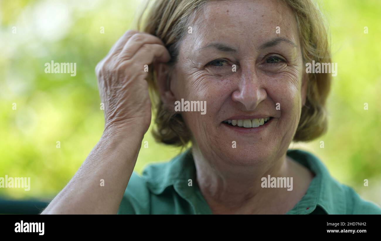 Happy senior woman in 60s smiling authentic laugh and smile Stock Photo ...