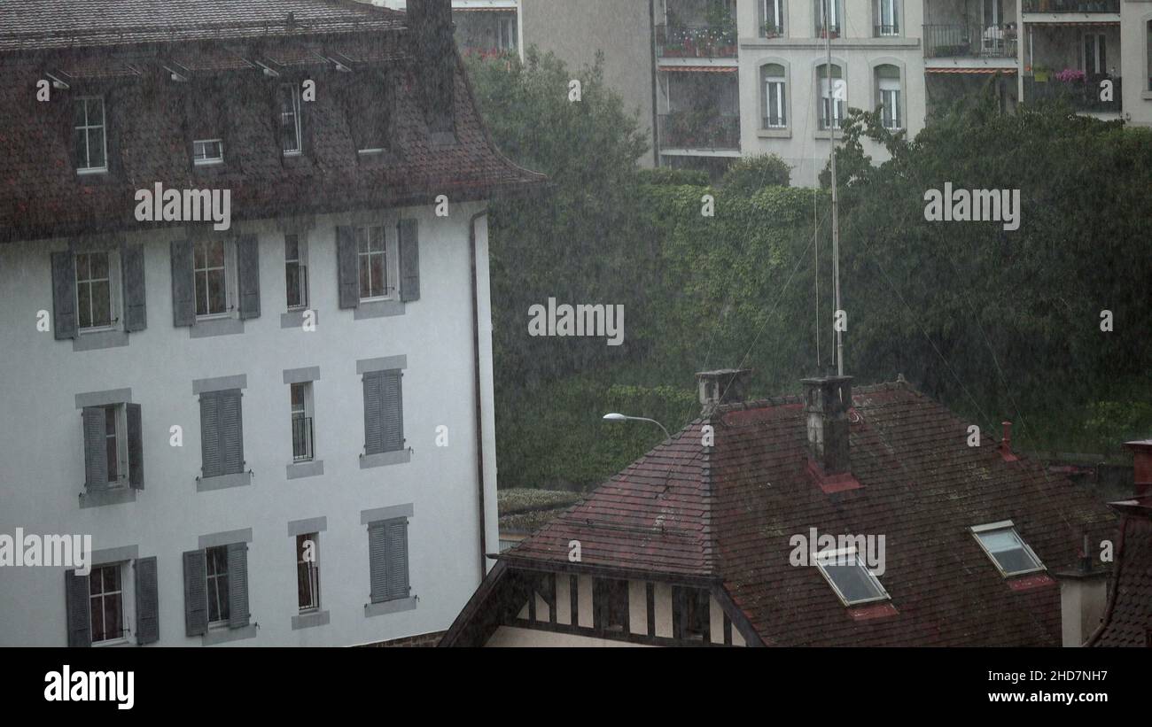 Falling rain in switzerland in slow-motion outside traditional city ...