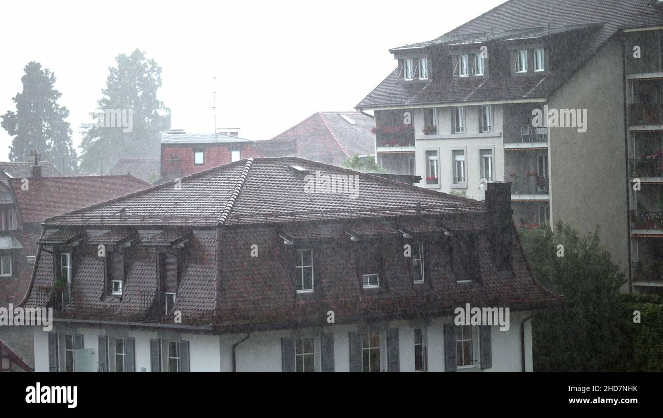 Falling rain in switzerland in slow-motion outside traditional city ...