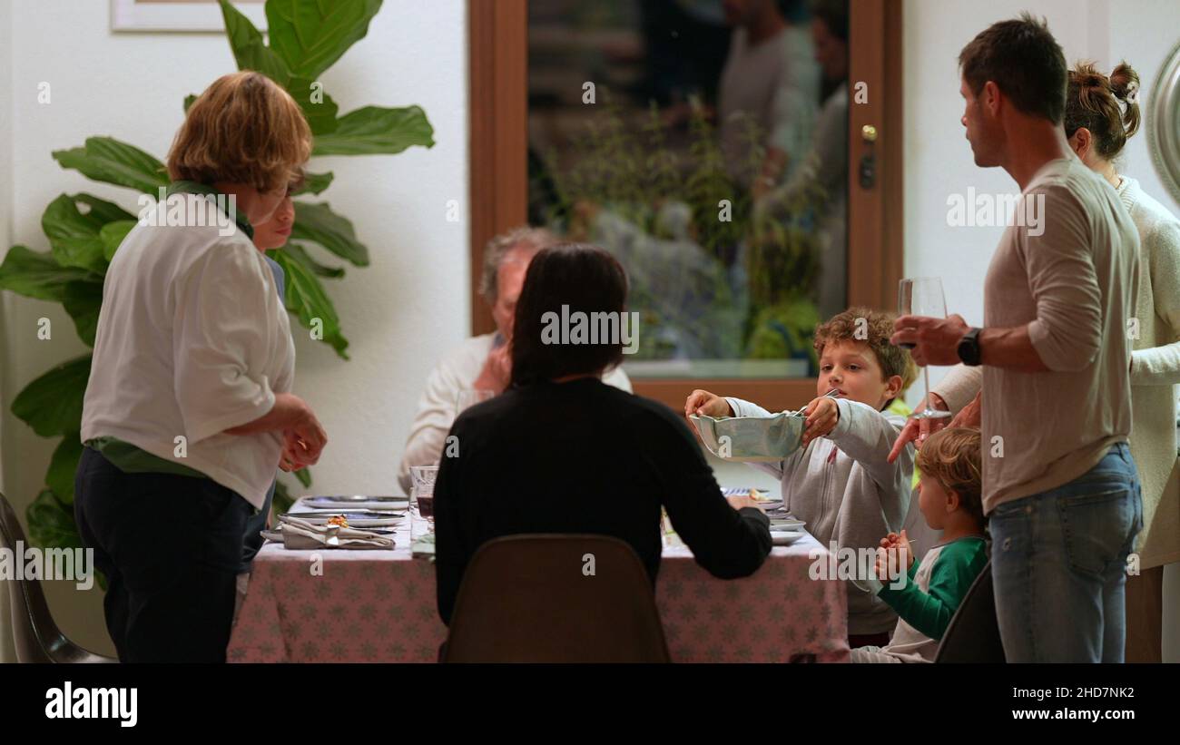 Family gathered together at home dinner, authentic real life family ...