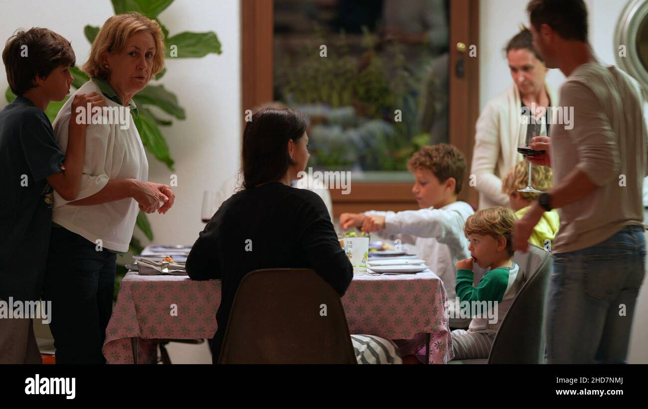 Family gathered together at home dinner, authentic real life family ...