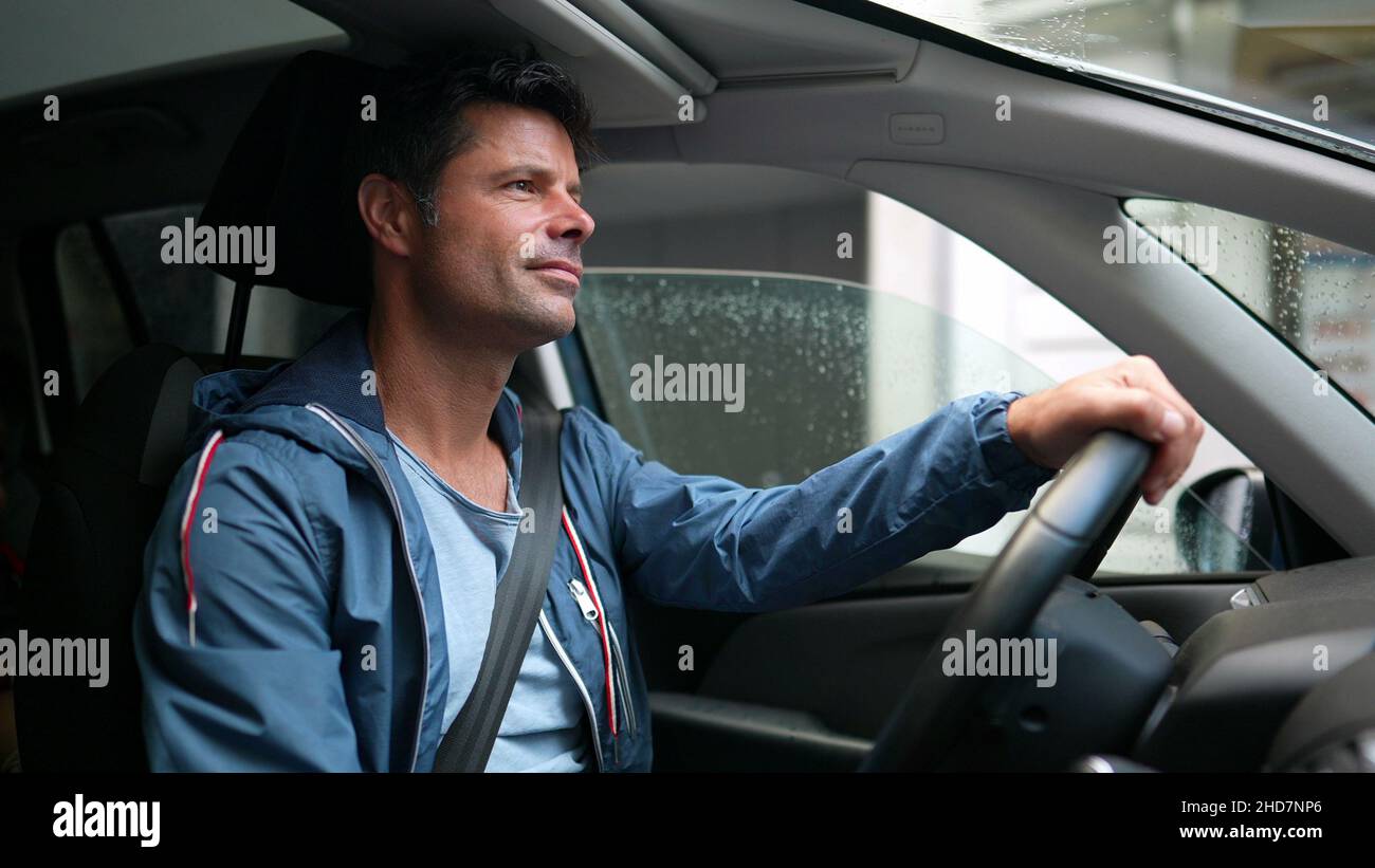 Handsome man driving car, 30s guy driver Stock Photo - Alamy