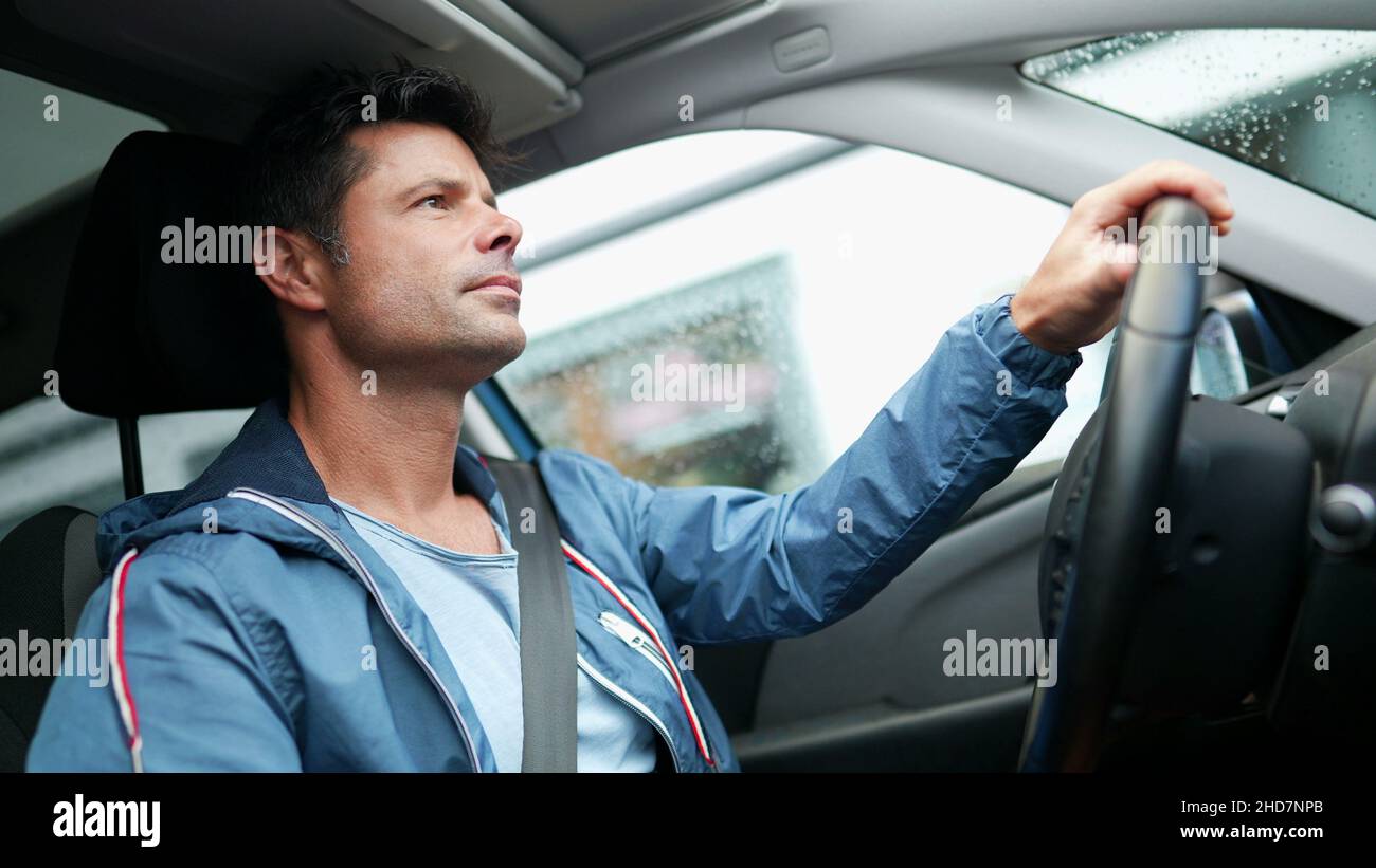 Handsome man driving car, 30s guy driver Stock Photo - Alamy