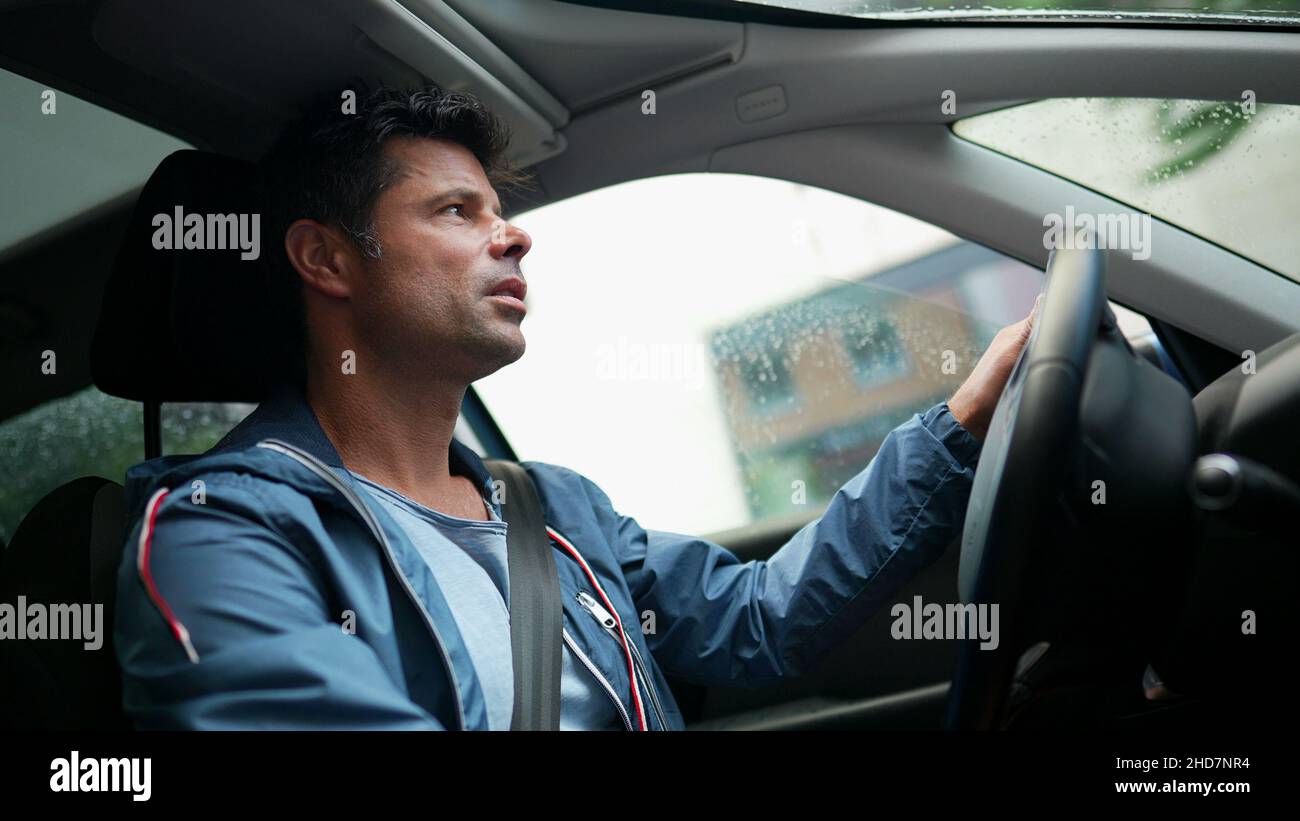 Handsome man driving car, 30s guy driver Stock Photo - Alamy