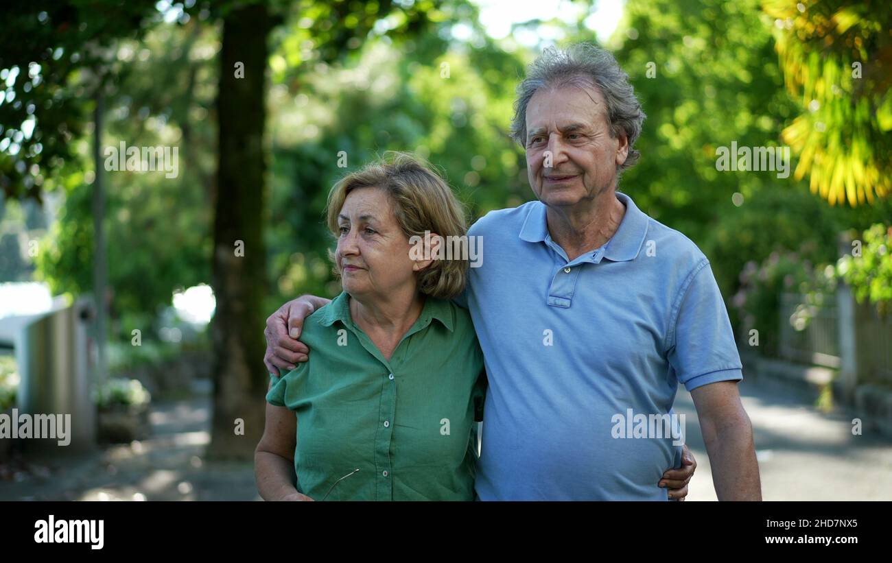 Happy senior couple in 60s walking embracing each other, old age relationship Stock Photo - Alamy