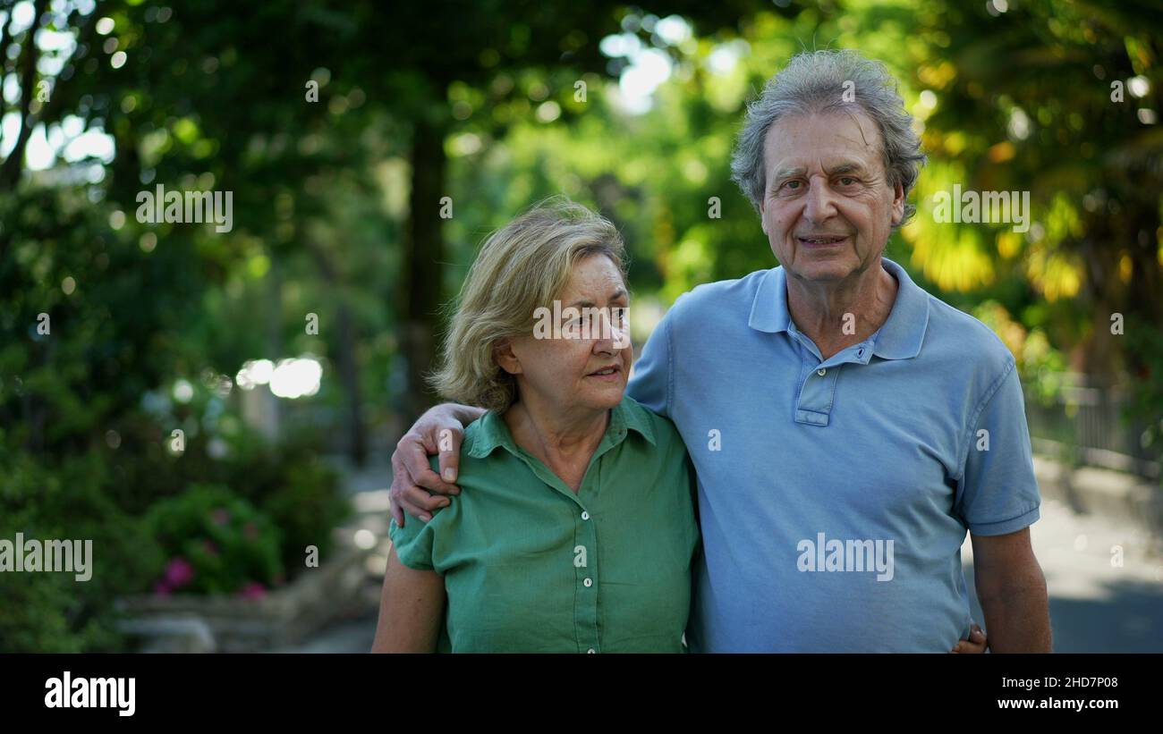 Happy senior couple in 60s walking embracing each other, old age relationship Stock Photo - Alamy