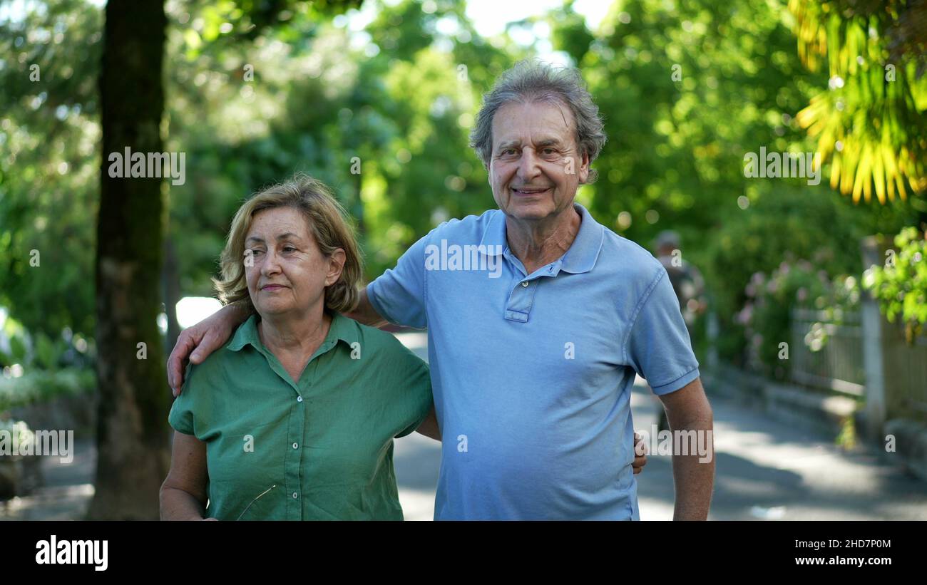 Happy senior couple in 60s walking embracing each other, old age relationship Stock Photo - Alamy
