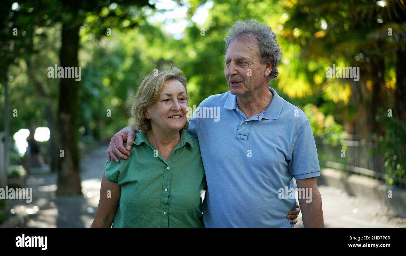 Happy senior couple in 60s walking embracing each other, old age relationship Stock Photo - Alamy
