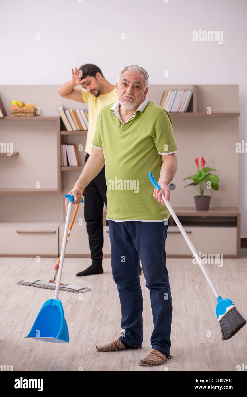 Father son sweeping floor hi-res stock photography and images - Alamy