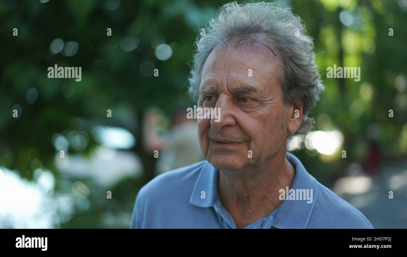 Happy senior man walking forward smiling. One older person walks in ...