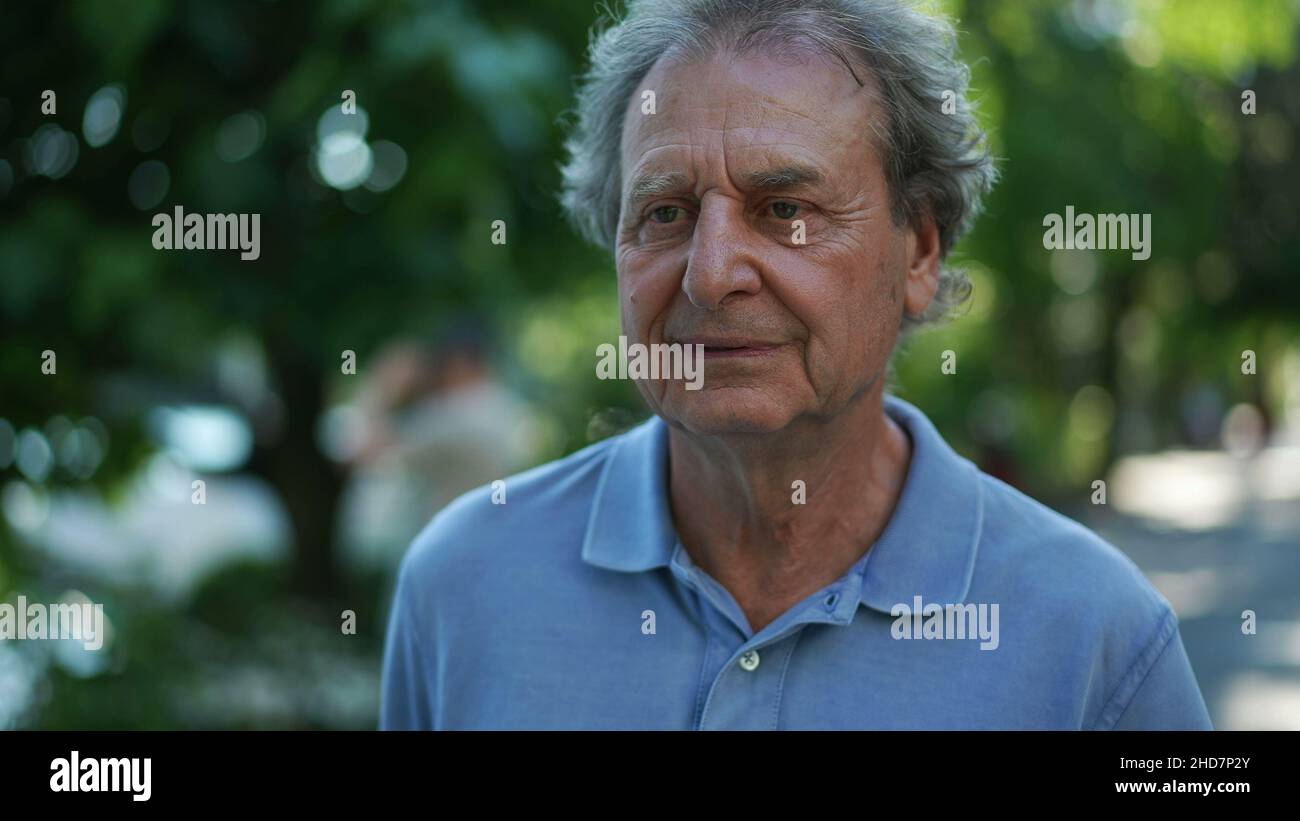Happy senior man walking forward smiling. One older person walks in ...