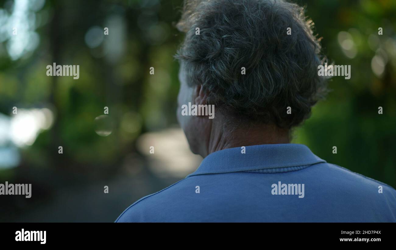 Happy senior man walking forward smiling. One older person walks in ...