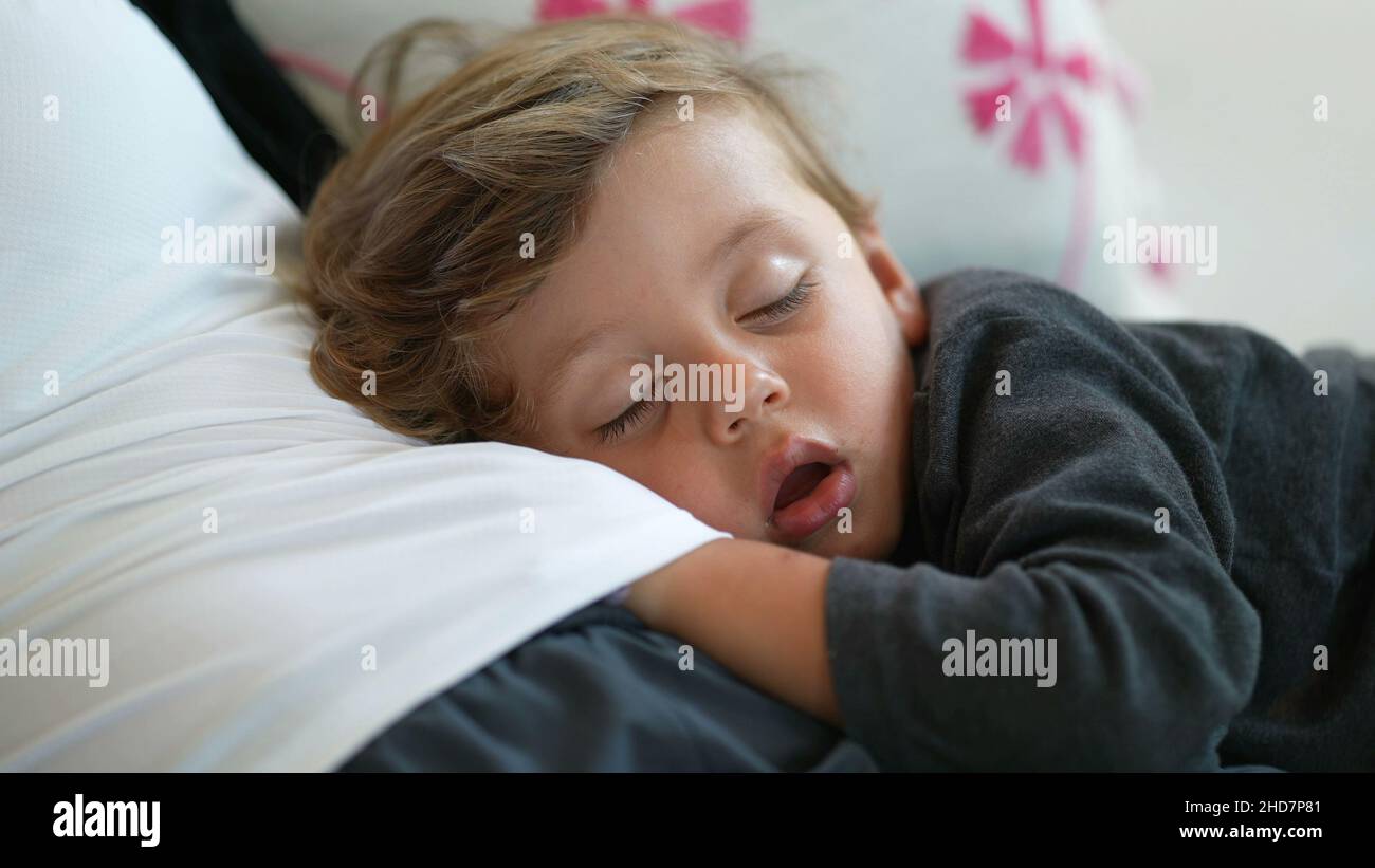 Little boy sleeping, toddler child asleep napping Stock Photo - Alamy