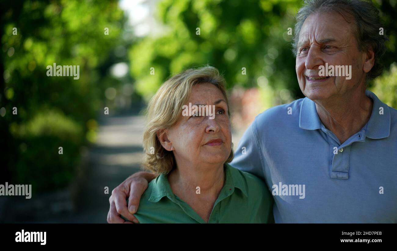 older couple walking together, senior people relationship outside in ...