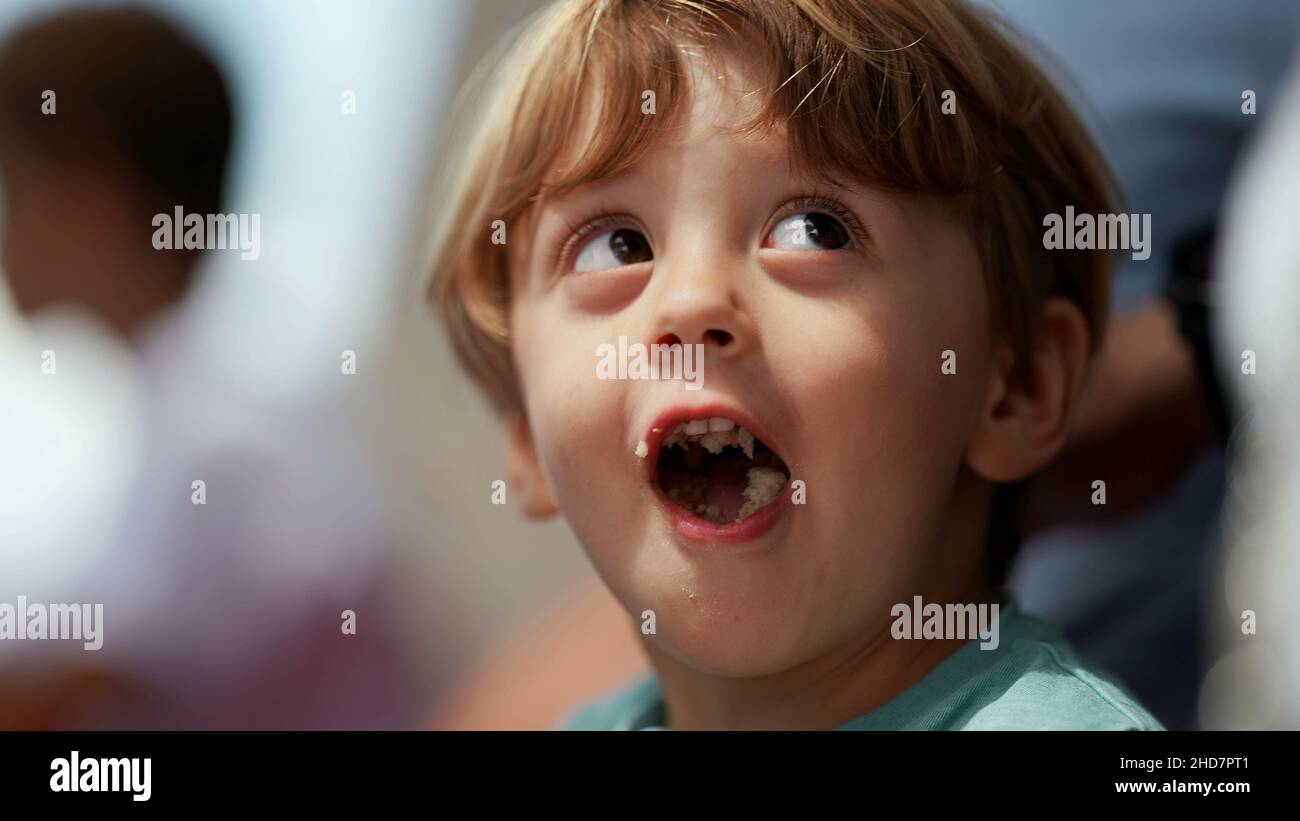 Playful little boy opening mouth with food inside. mischievous child ...