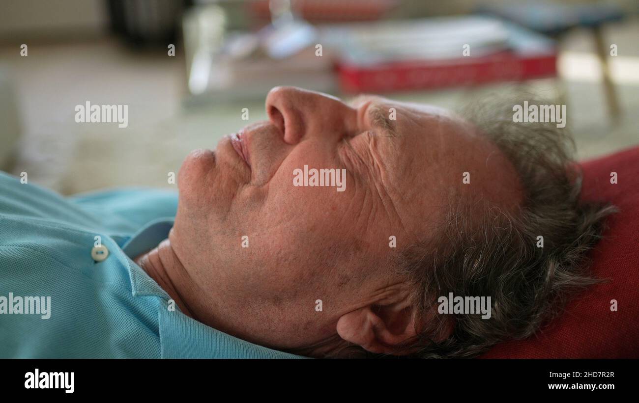 Senior person napping. Older man sleeping and resting in the afternoon ...
