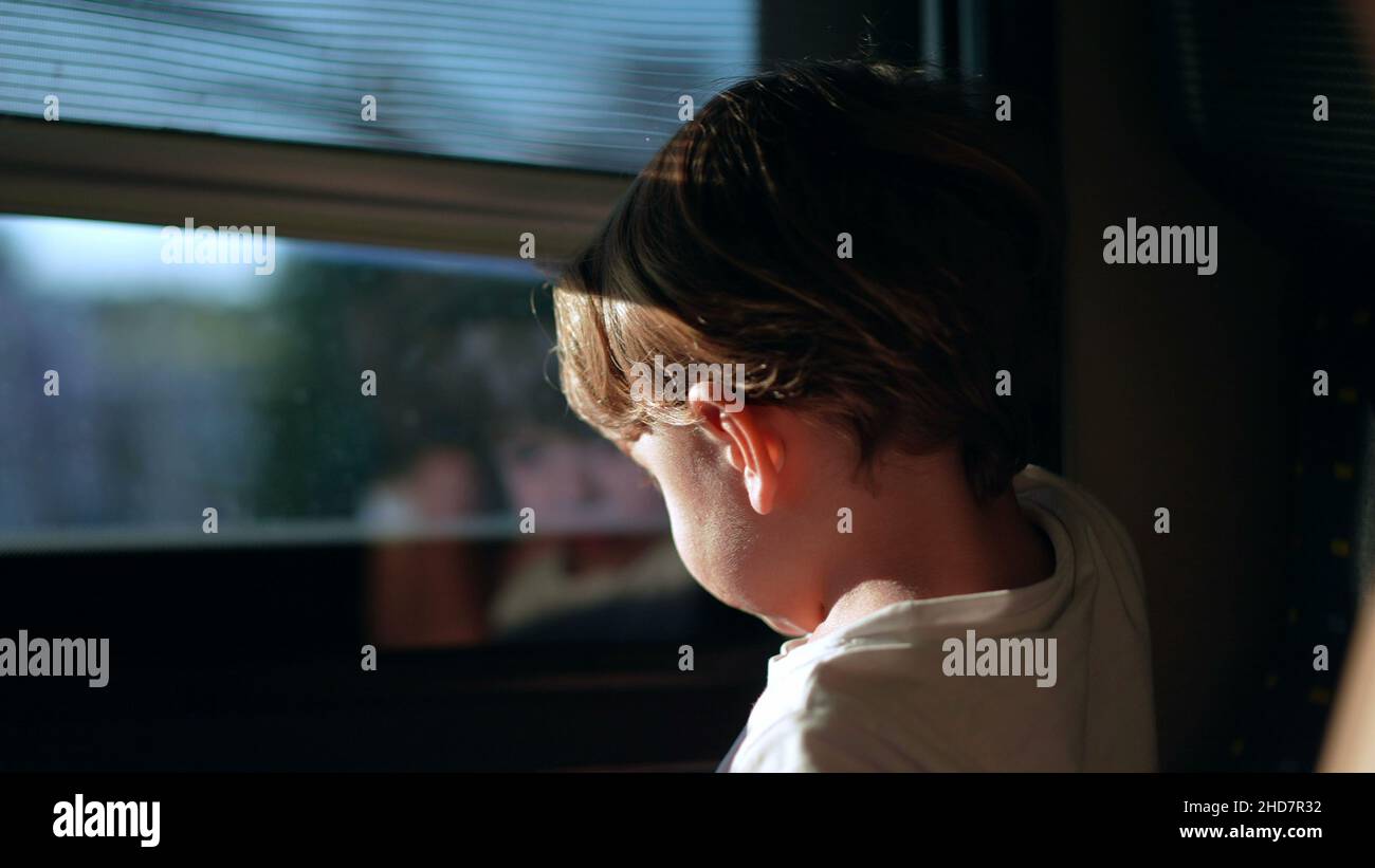 Small boy closing train window blind, child traveling by railroad Stock ...