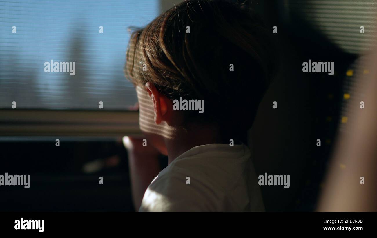 Small boy closing train window blind, child traveling by railroad Stock ...