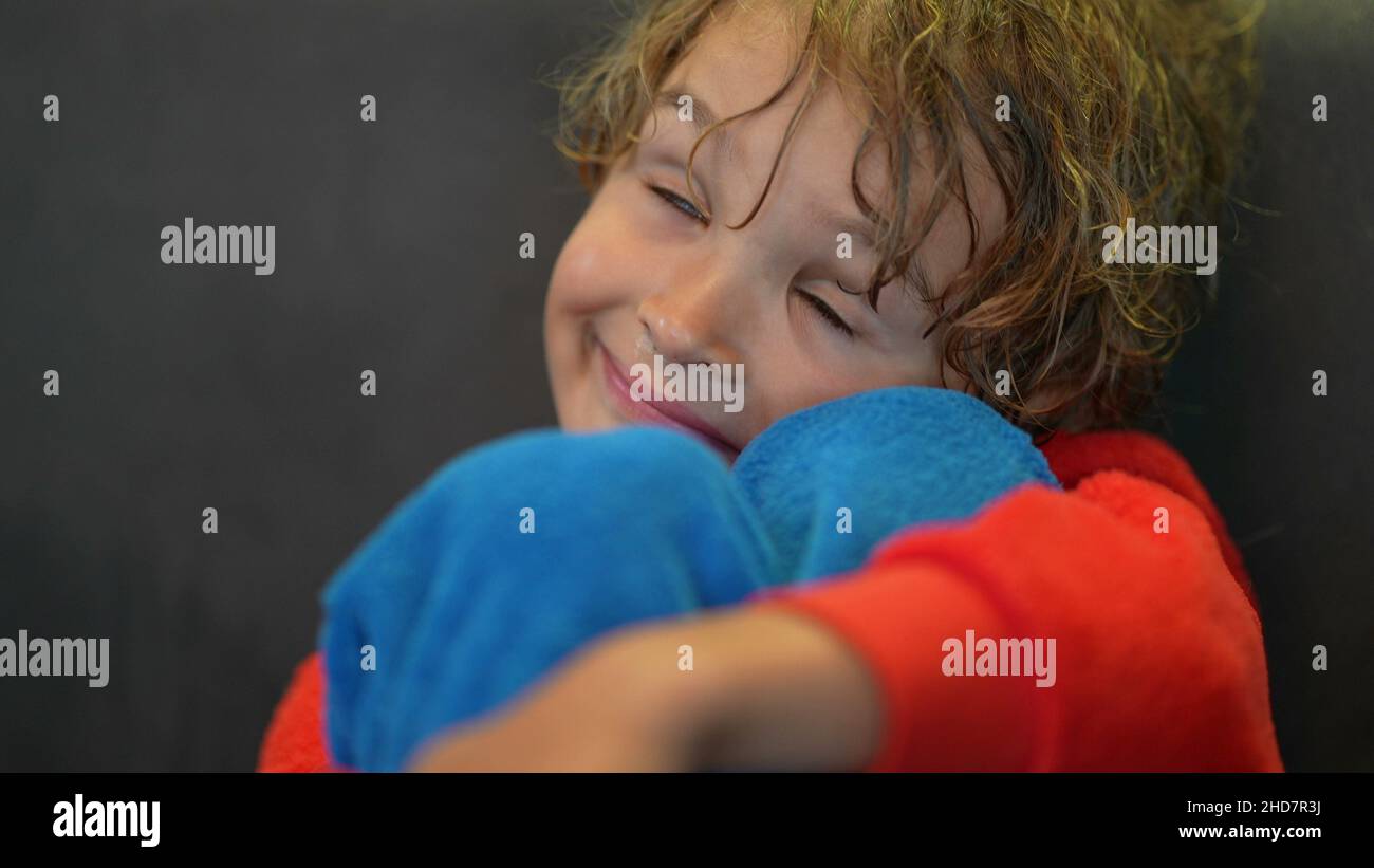 Small handsome boy lying down hi-res stock photography and images - Alamy