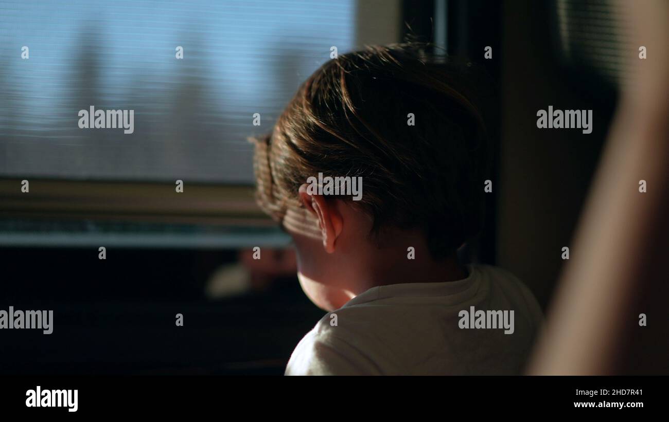 Small boy closing train window blind, child traveling by railroad Stock ...
