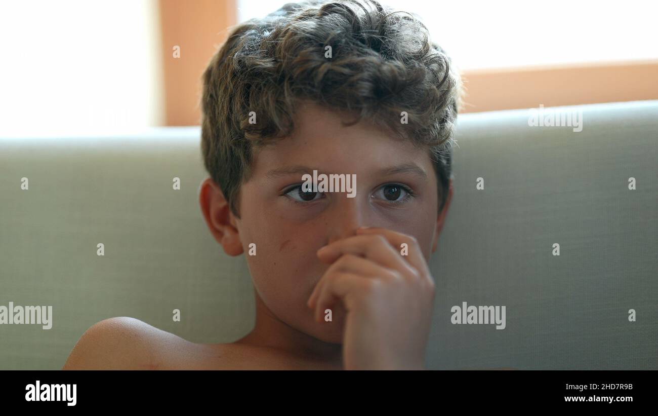 Young boy face watching TV, kid staring at entertainment program Stock ...