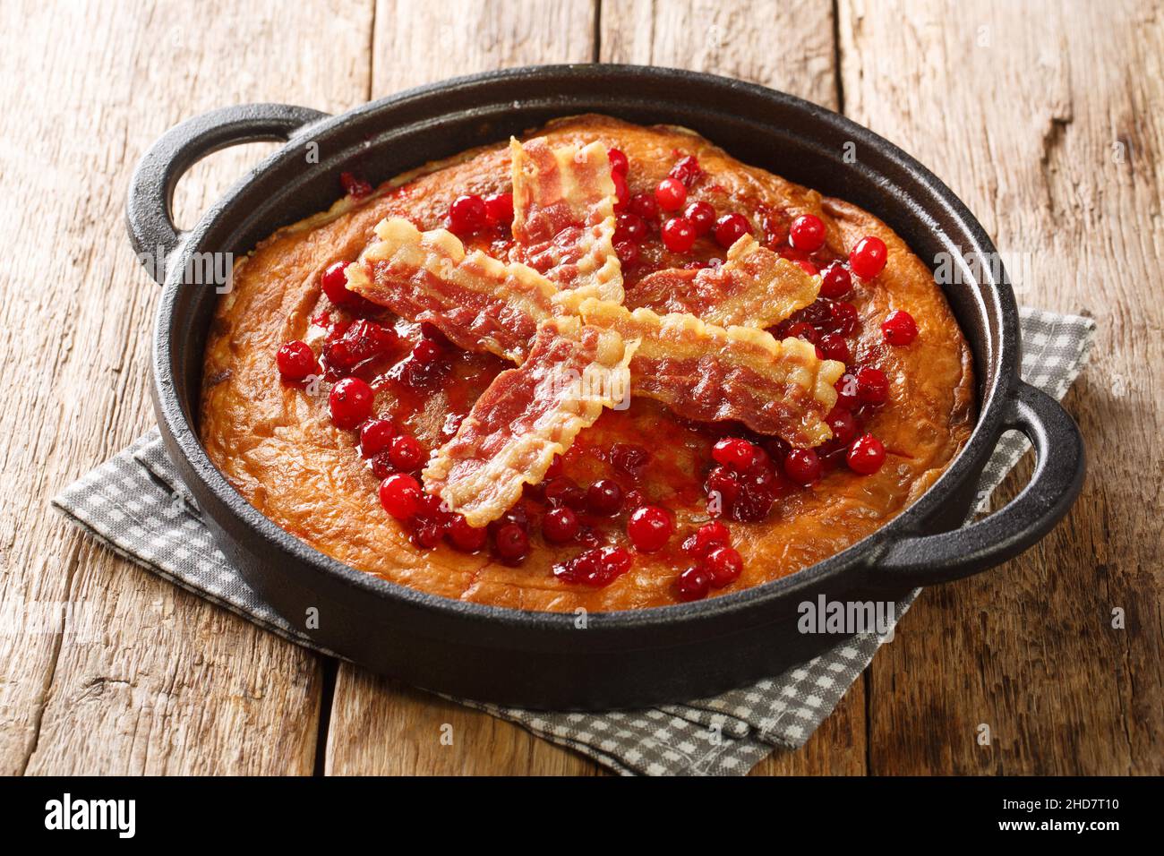 Scanian Egg Cake skansk aggakaka close up in the pan on the wooden ...