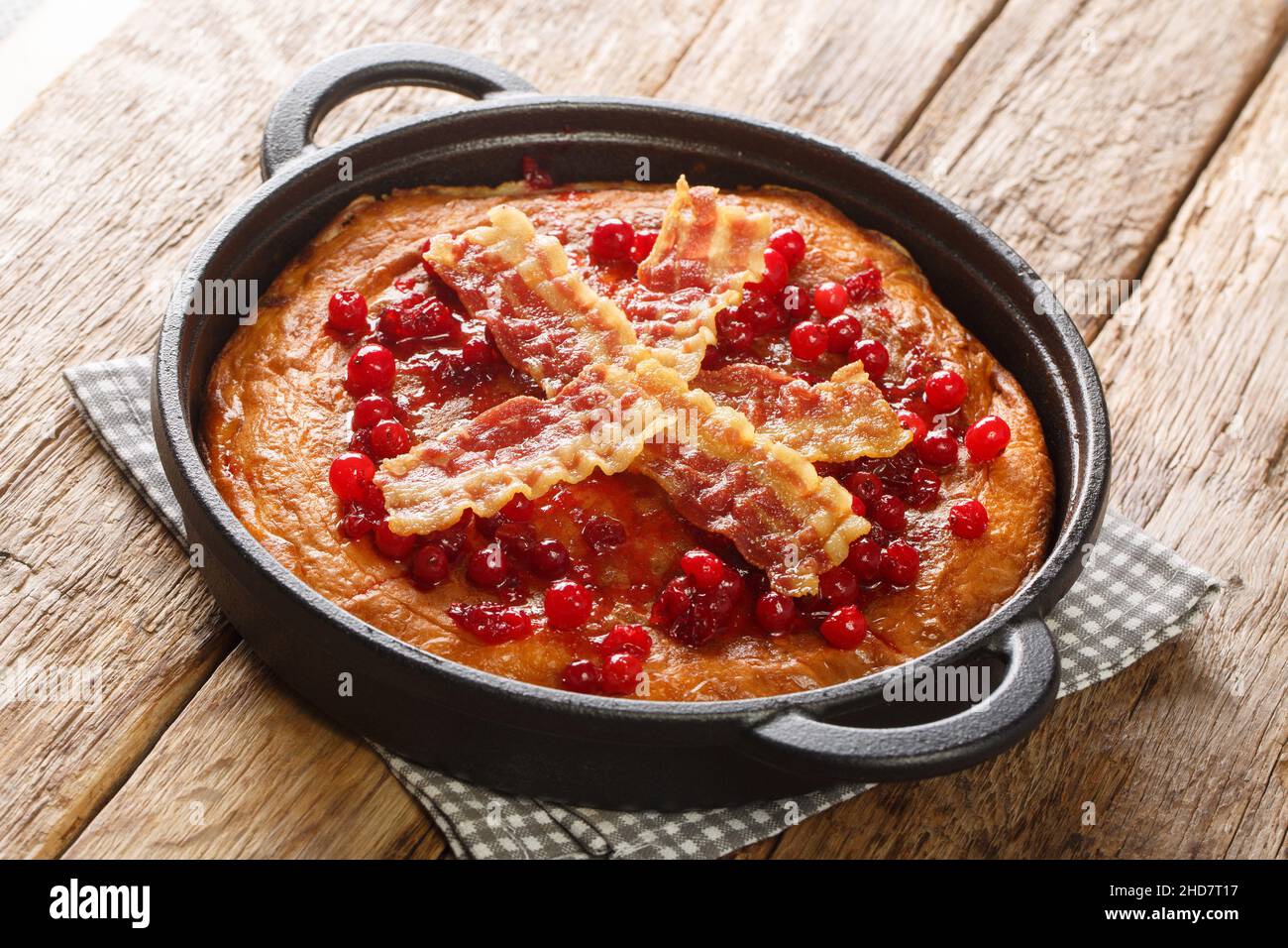 Traditional delicious Swedish egg pancake Aggakaga with crispy bacon ...