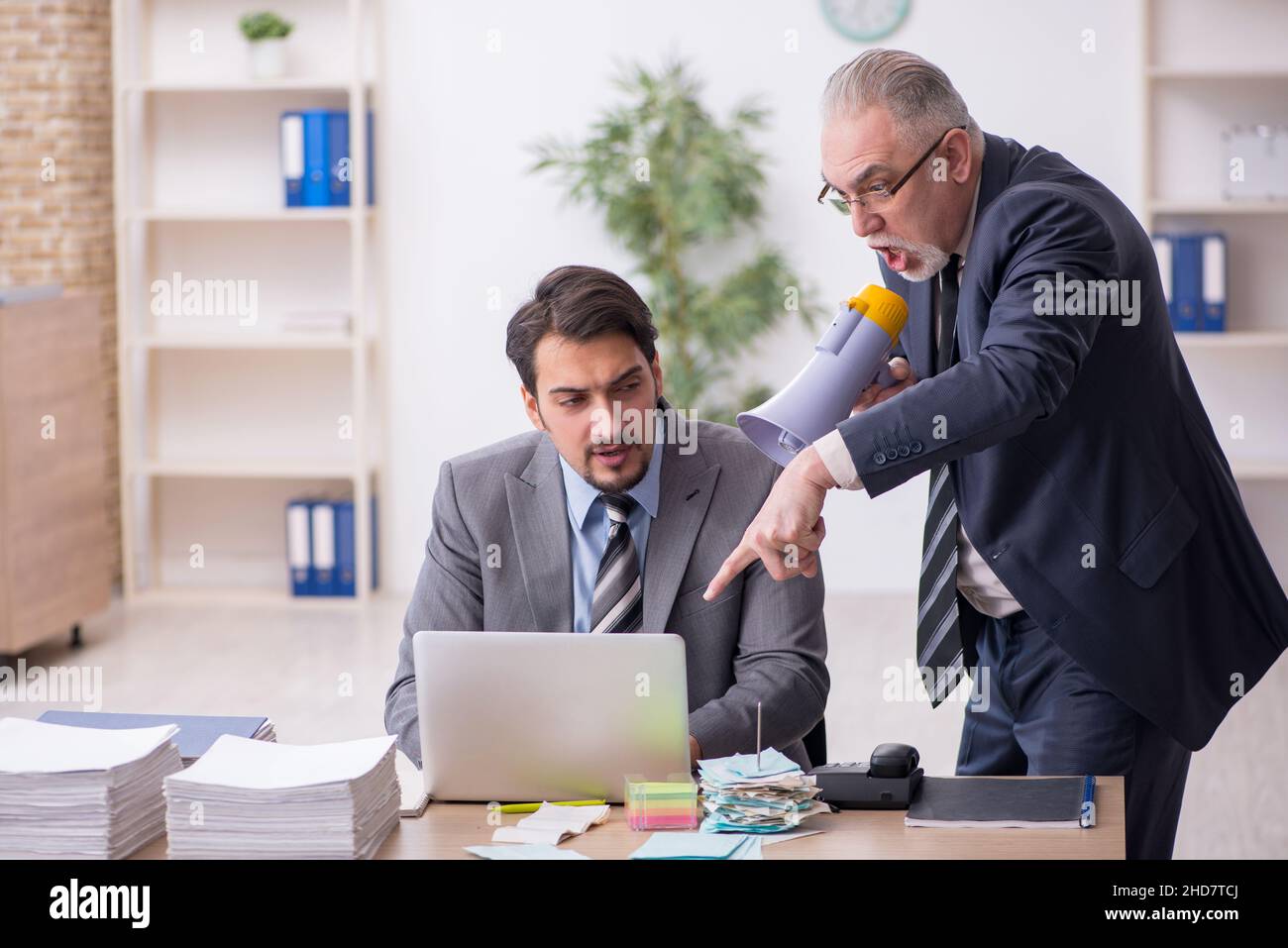 Two employees in bullying concept Stock Photo - Alamy