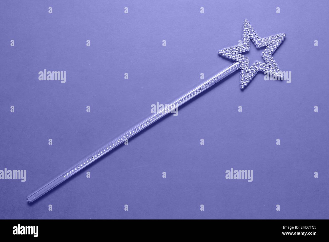 Sparkling magic wand on a pink background. Concept of celebration and ...