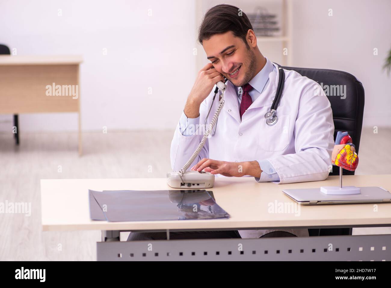 Smiling male doctor cardiogram hi-res stock photography and images - Alamy