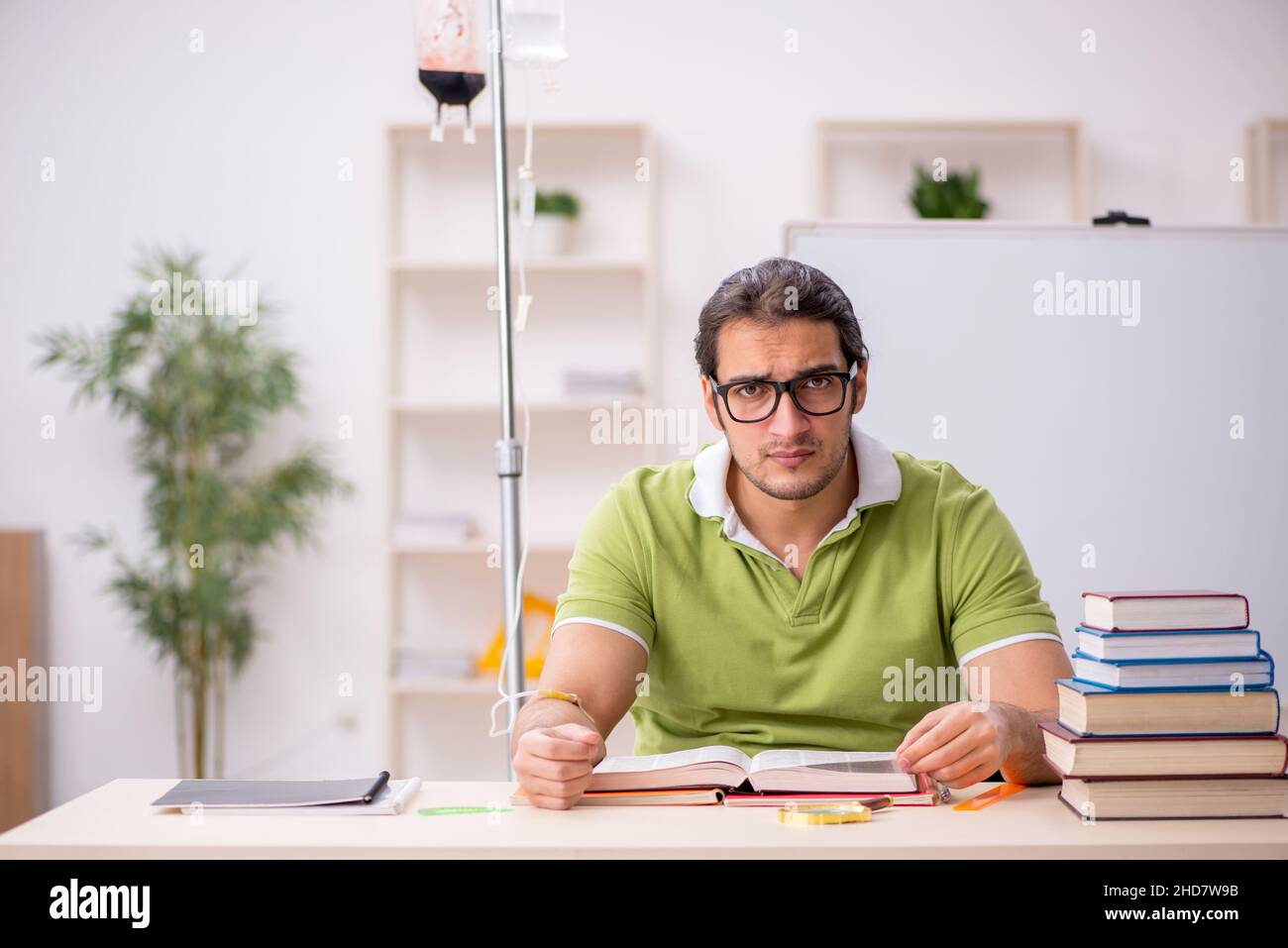 Young sick teacher student in blood transfusion concept Stock Photo - Alamy